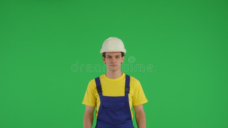 Medium Green Screen Isolated Chroma Key Shot of a Young Construction ...