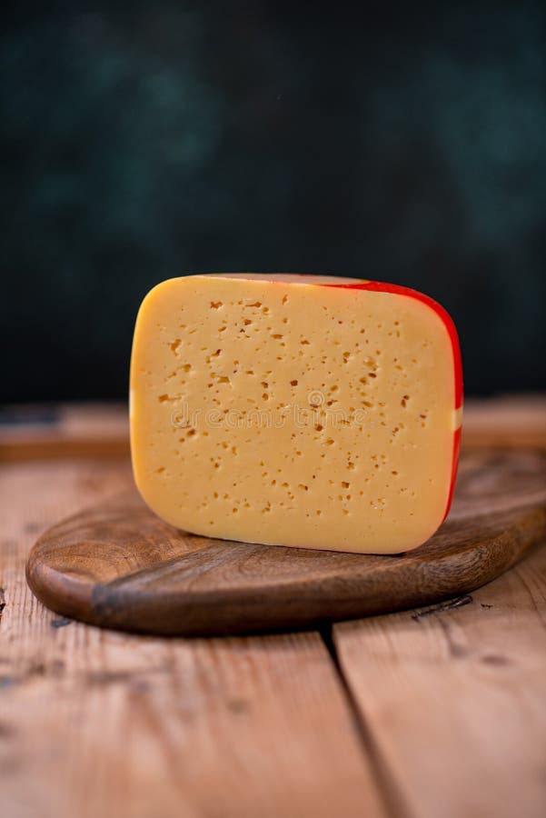 Medium Hard Cheese Gouda Edam on Wooden Board on Sunlight Table ...