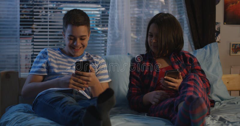 Siblings talking at night stock image. Image of teenagers - 144650295
