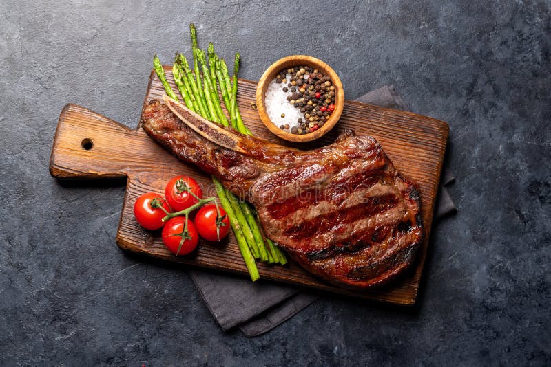 Medium Rare Grilled Tomahawk Beef Steak with Asparagus Stock Image ...