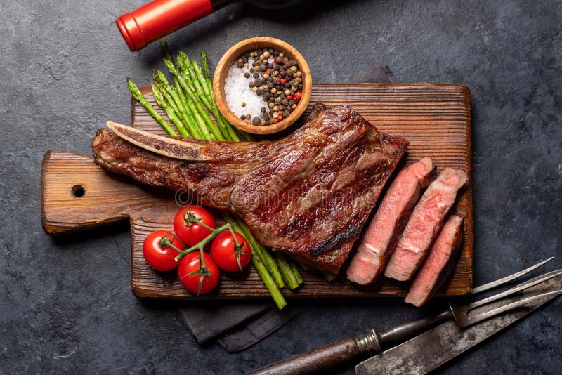 Medium Rare Grilled Tomahawk Beef Steak with Asparagus Stock Image ...
