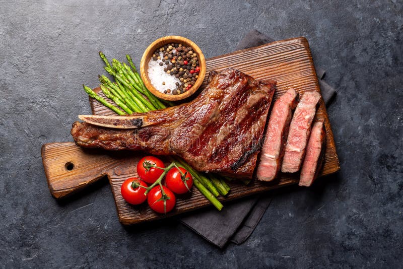 Medium Rare Grilled Tomahawk Beef Steak with Asparagus Stock Photo ...