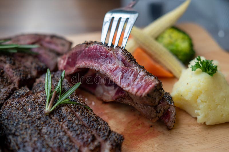 Medium rare meat on fork stock photo. Image of fillet - 285500832