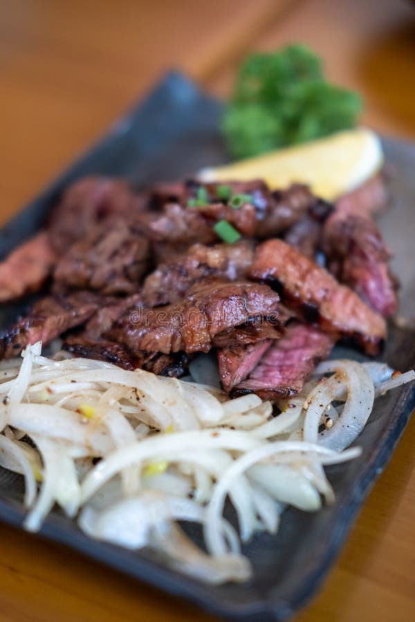 Medium rare meat on plate stock photo. Image of gourmet - 335740444