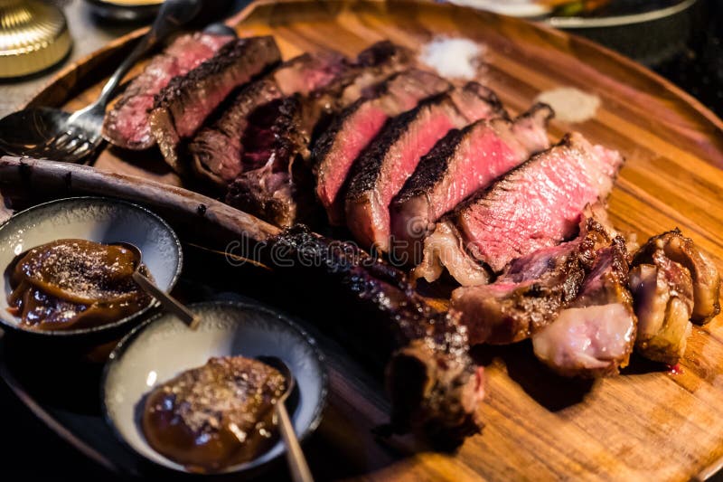 Medium rare Tomahawk meat stock image. Image of beef - 361768013