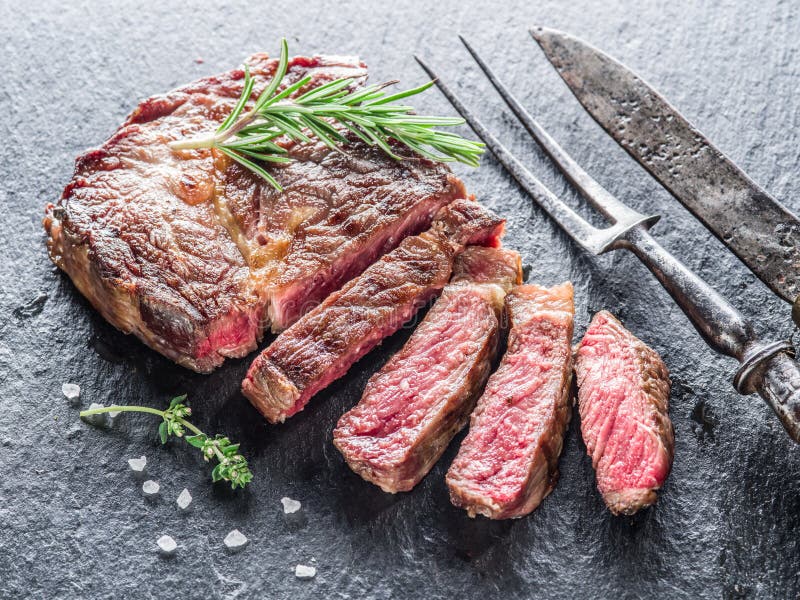 Medium Ribeye steak. stock image. Image of knife, rosemary - 85420253