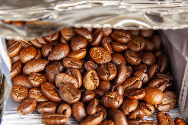 Medium-roasted Coffee Beans are in an Open Package. Close-up Stock ...