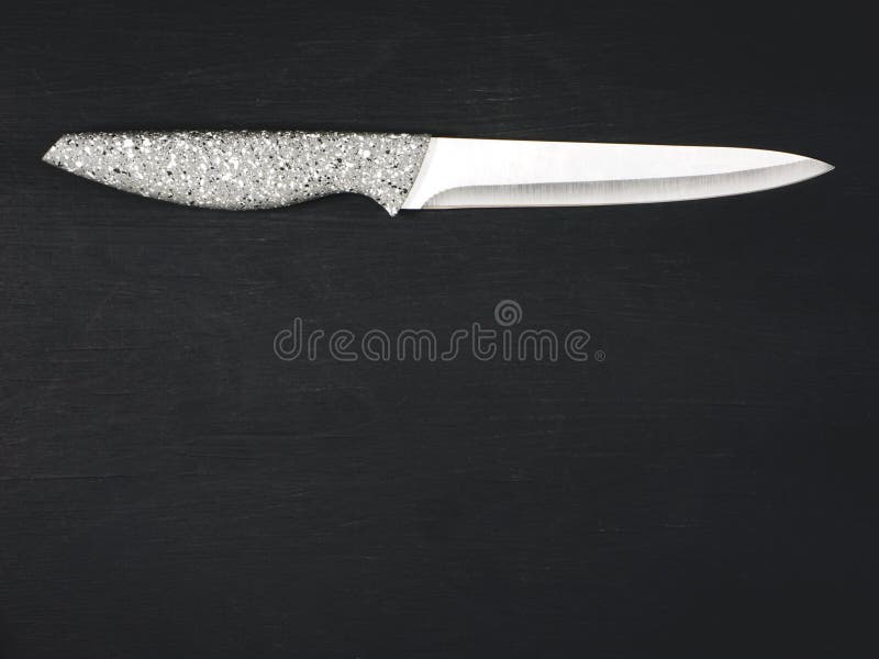 Medium Sharp Kitchen Knife with Gray Handle on a Black Wooden Board ...
