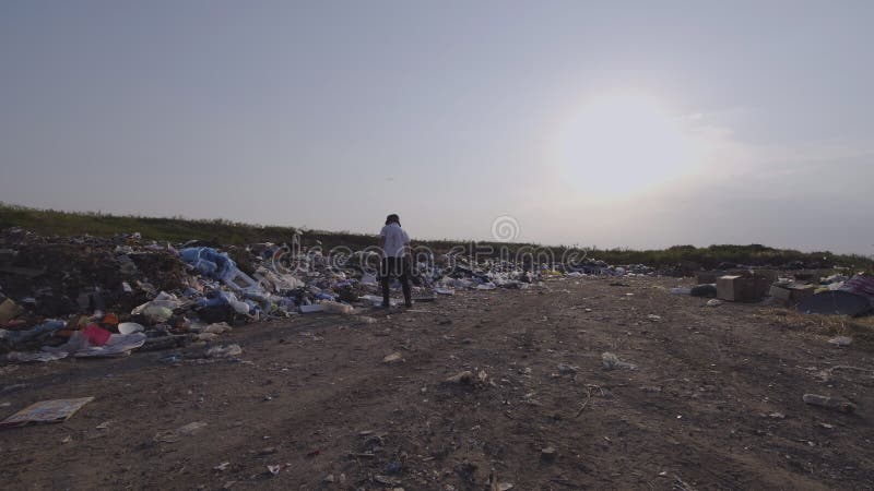 Angry boy walking in dump stock video. Video of annoyed - 153072421