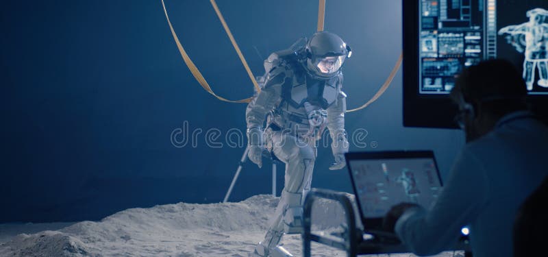 Astronaut and Scientists Testing Spacesuit Mobility Stock Photo - Image ...