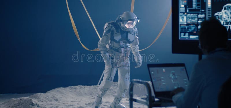 Astronaut and Scientists Testing Spacesuit Mobility Stock Photo - Image ...