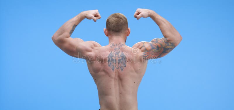 Buff man flexing his arms stock photo. Image of studio - 166308248