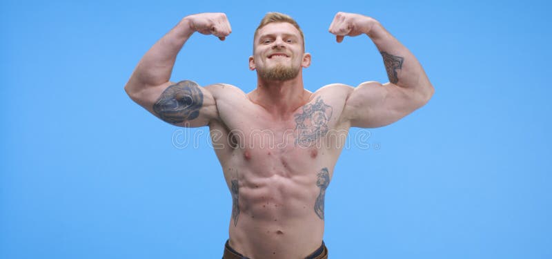 Buff man flexing his arms stock image. Image of flexing - 166308647