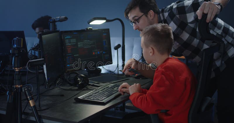 Child Programmer Getting Instructions from Colleague Stock Footage ...