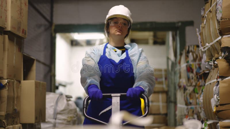 Side View Female Employee Sorting Garbage on Recycling Station Checking ...