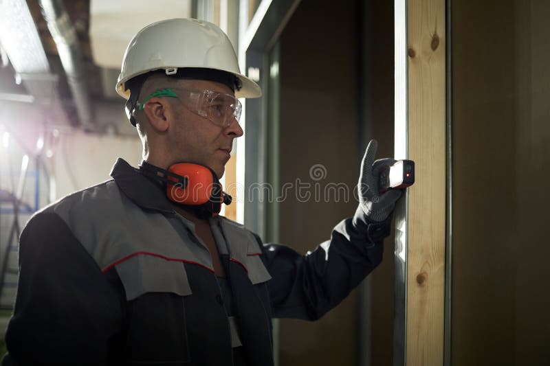 Content Man Looking at Display of Laser Level Stock Image - Image of ...