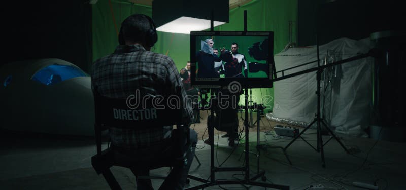 Cosmetician Preparing an Actor while Others Discussing the Scene Stock ...