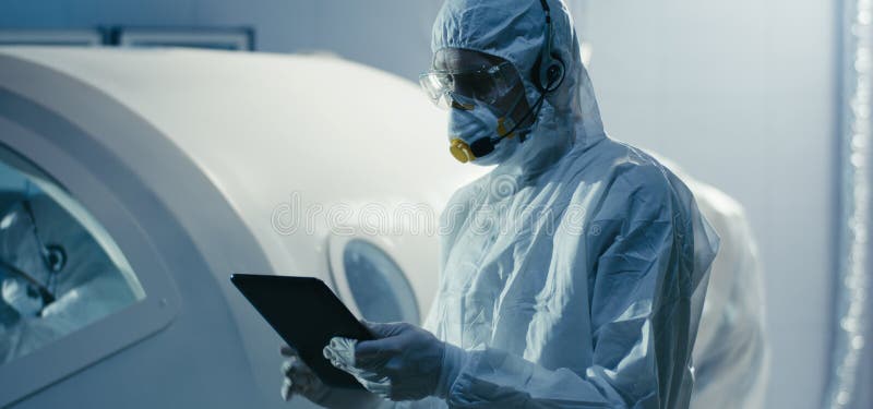Engineer Using Tablet in Clean Room Stock Photo - Image of tablet ...