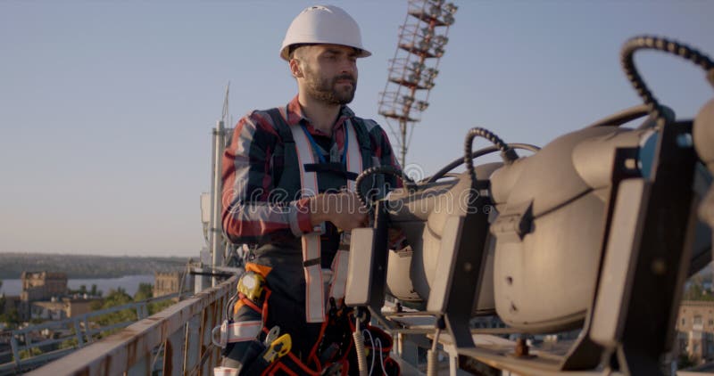 Engineer Working on a Cellular Tower Stock Photo - Image of engineering ...