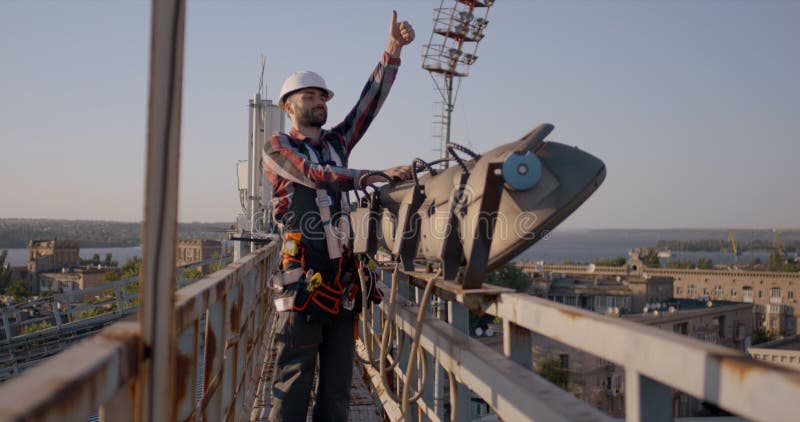 Engineer Working on a Cellular Tower Stock Image - Image of yelling ...