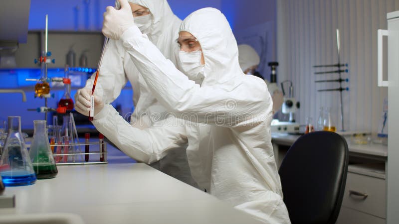 Biologist Examining a Virus Sample in Laboratory Stock Photo - Image of ...