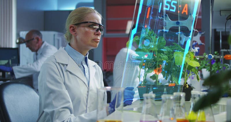 Scientist Using a Holographic Display Screen Stock Photo - Image of ...