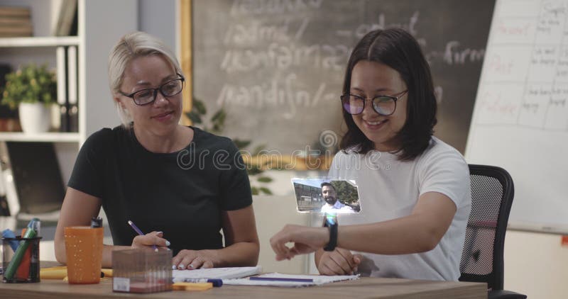 Student Using a Smartwatch for a Video Call Stock Photo - Image of ...