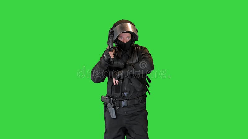 Counter Terrorist Soldier in Armor Standing and Reloading Machine Gun ...