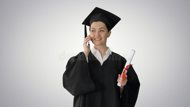 Emotional Female Student in Graduation Robe Talking on the Phone Stock ...