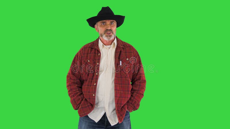 Serious American Farmer Looking at Camera and Talking on a Green Screen ...