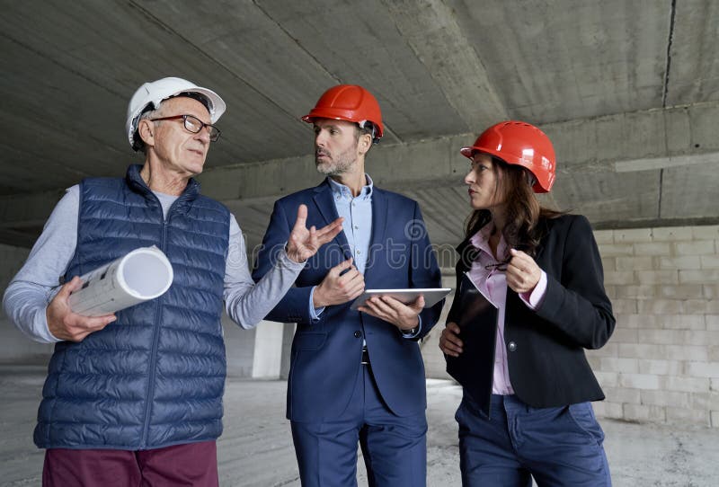 Working Engineers on the Construction Site Stock Image - Image of ...