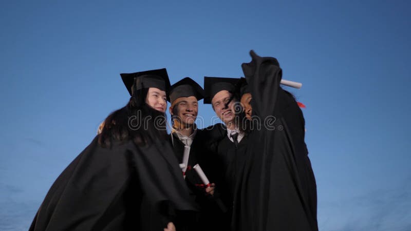 Happy Graduating Students Multi-ethnic Group is Hugging and Doin Stock ...