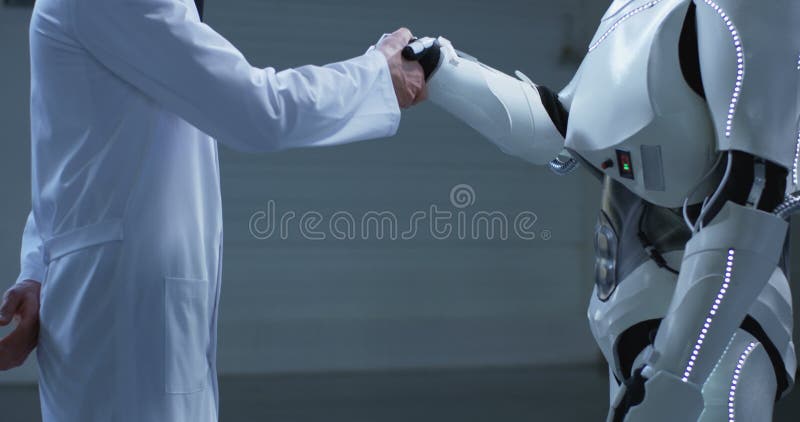Man and Robot Shaking Hands Stock Footage - Video of futuristic ...