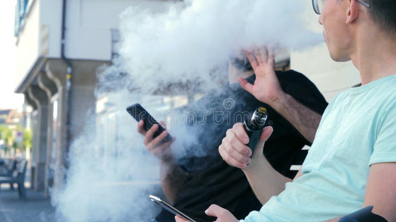 Man Reacts Laughing on a Smoke from Vape. Stock Image - Image of smoke ...