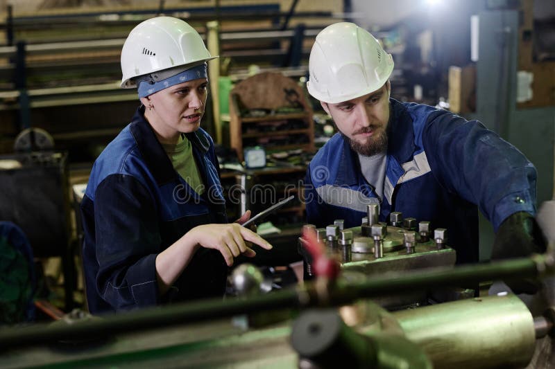 Two Workers Using Industrial Equipment Stock Photo - Image of hardhat ...