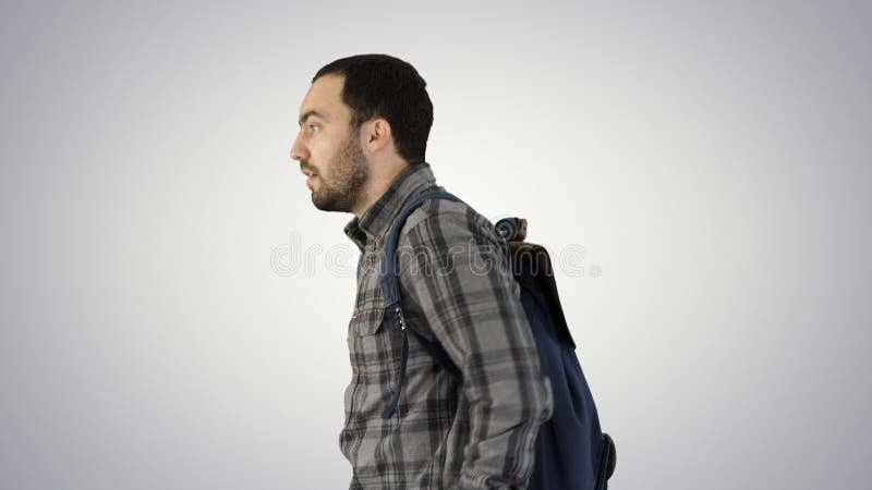 Portrait of Man Putting Backpack on on Gradient Background. Stock Image ...