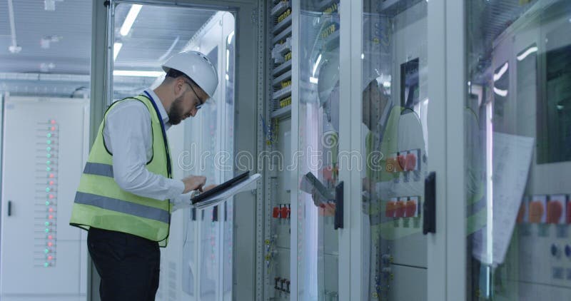 Electrical Worker Reading His Tablet Stock Image - Image of employee ...