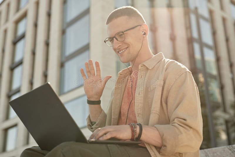 It Programmer Using Laptop Waving Hand during Online Meeting Outdoors Stock Image - Image of ...