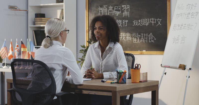 Teacher Explaining To Student in the Classroom Stock Photo - Image of ...