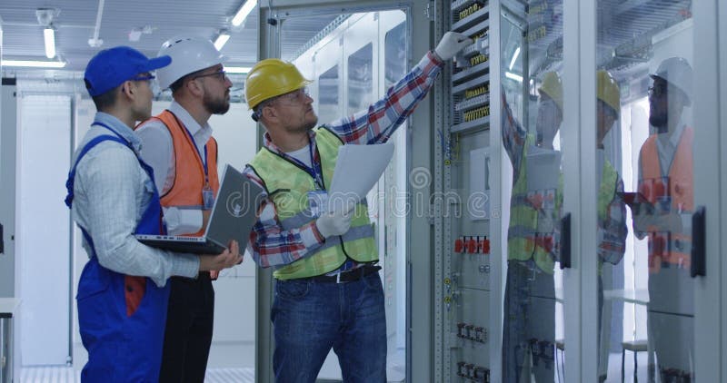 Electrical Workers Working in the Control Room Stock Image - Image of ...