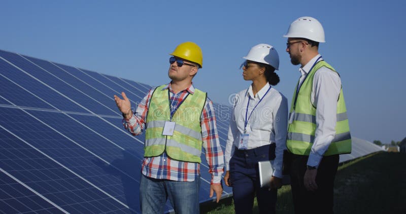 Electrical Workers Walking at a Solar Farm Stock Photo - Image of ...