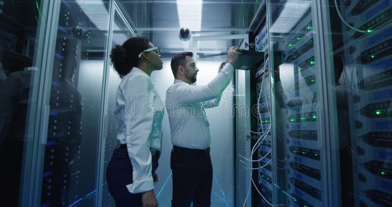 Two Employees Performing Maintenance in a Data Center Stock Image ...