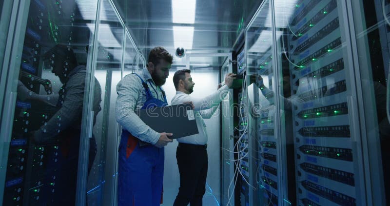 Two Men Performing Maintenance in a Data Center Stock Video - Video of ...