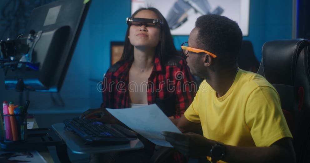 Video Game Developers Working Together Stock Photo - Image of ...