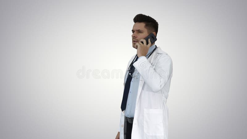 Doctor Making a Serious Phone Call on Gradient Background. Stock Video ...