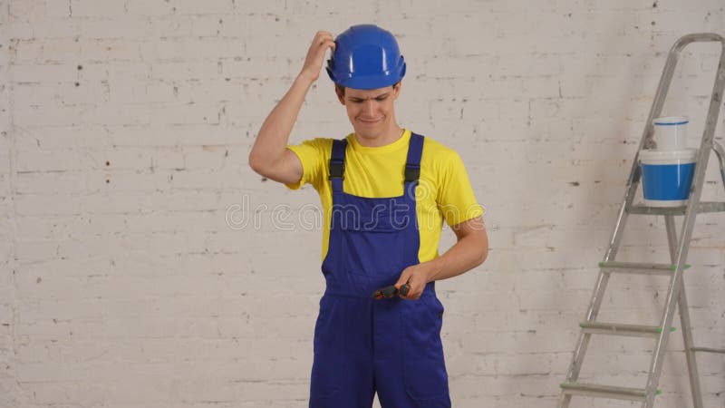 Medium Shot of a Young Construction Worker Standing in the Room Under ...