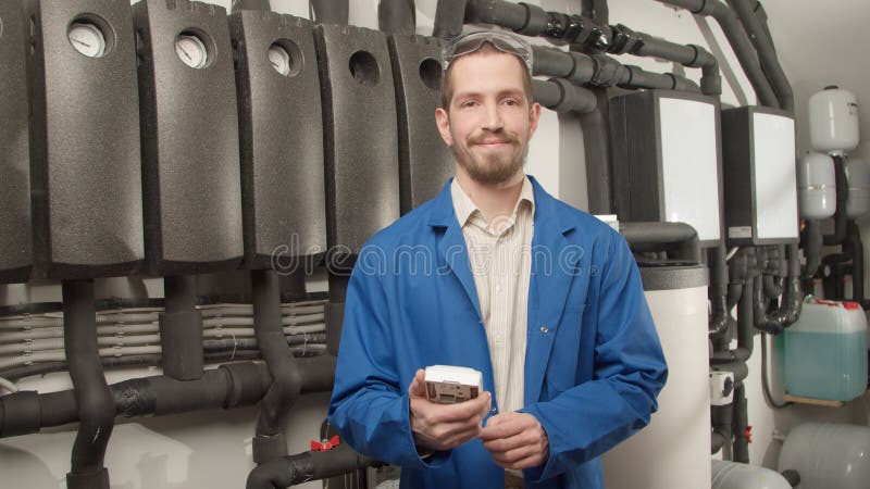 Young Engineer Smiling at Camera with Controller Stock Image - Image of ...