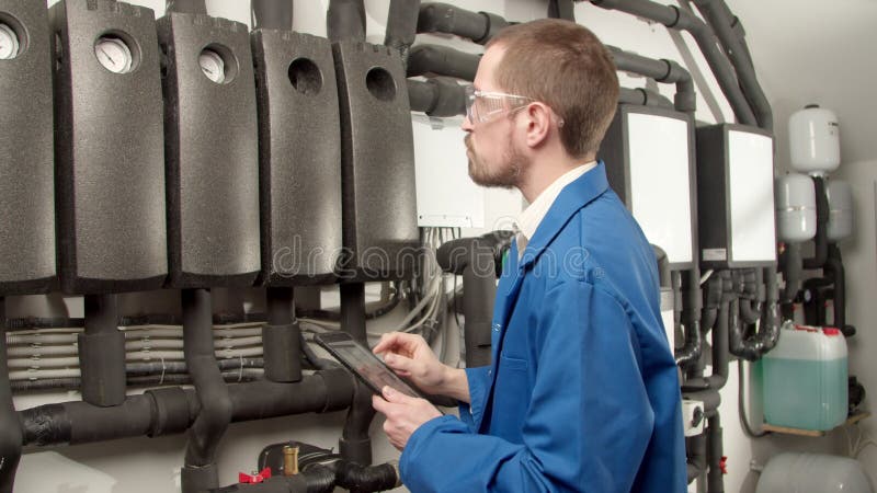 Young Engineer Checking Pressure Gauges Stock Video - Video of engineer ...