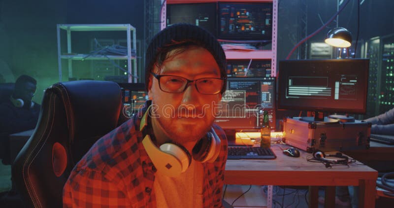 Hacker Laughing Then Glaring into Camera Stock Photo - Image of ...