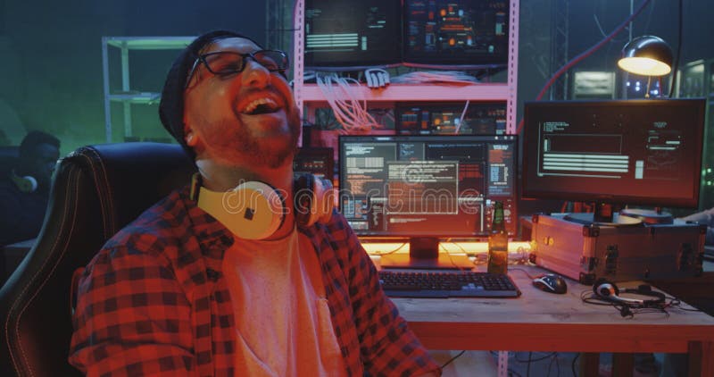 Hacker Laughing Then Glaring into Camera Stock Photo - Image of ...